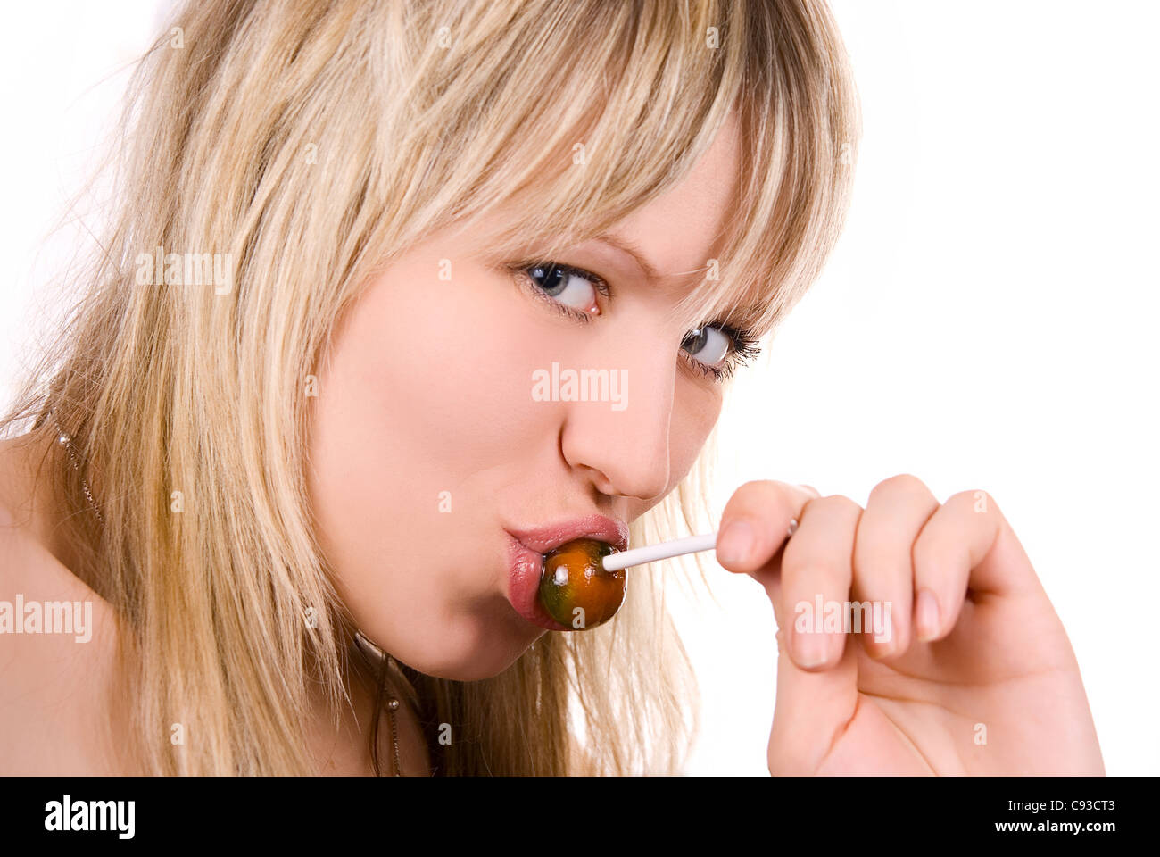 De belles jeunes femmes suçant une sucette on white Photo Stock - Alamy