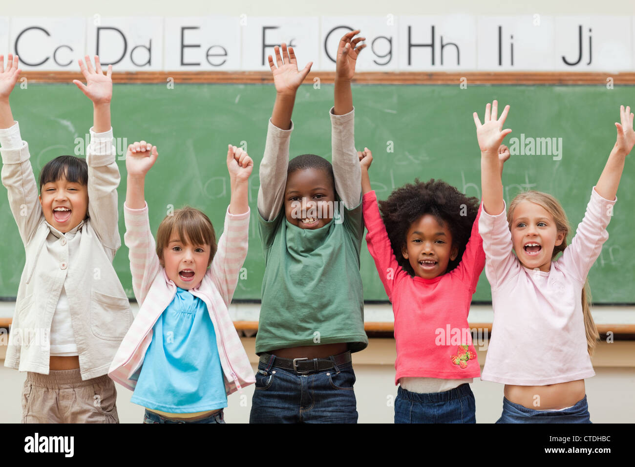 Students cheering classroom Banque de photographies et d’images à haute ...