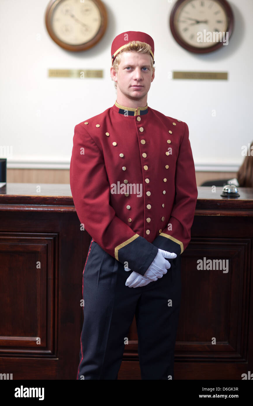 Groom standing in hotel lobby Photo Stock - Alamy