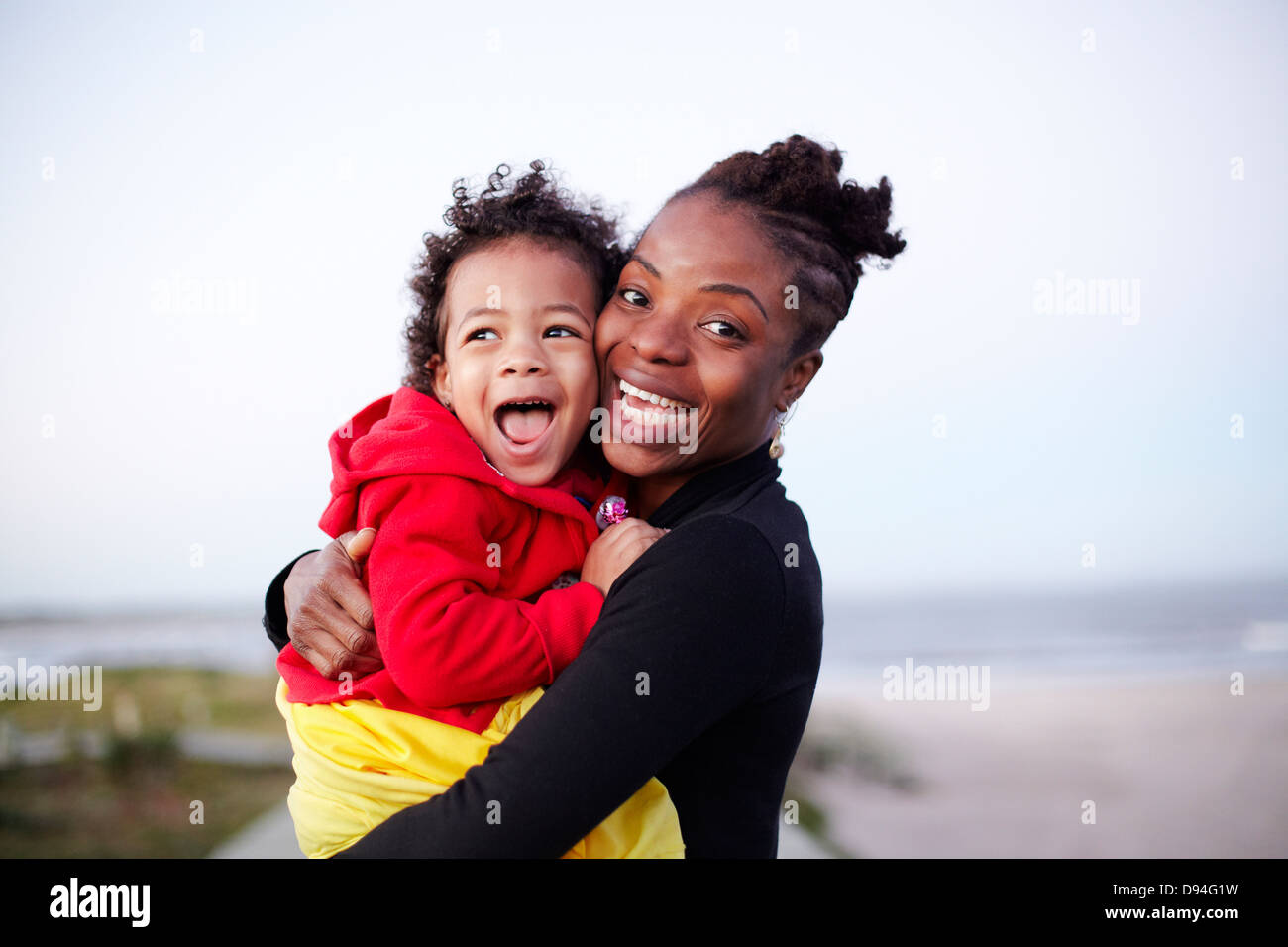 Mere Africaine A La Plage Banque De Photographies Et Dimages à Haute