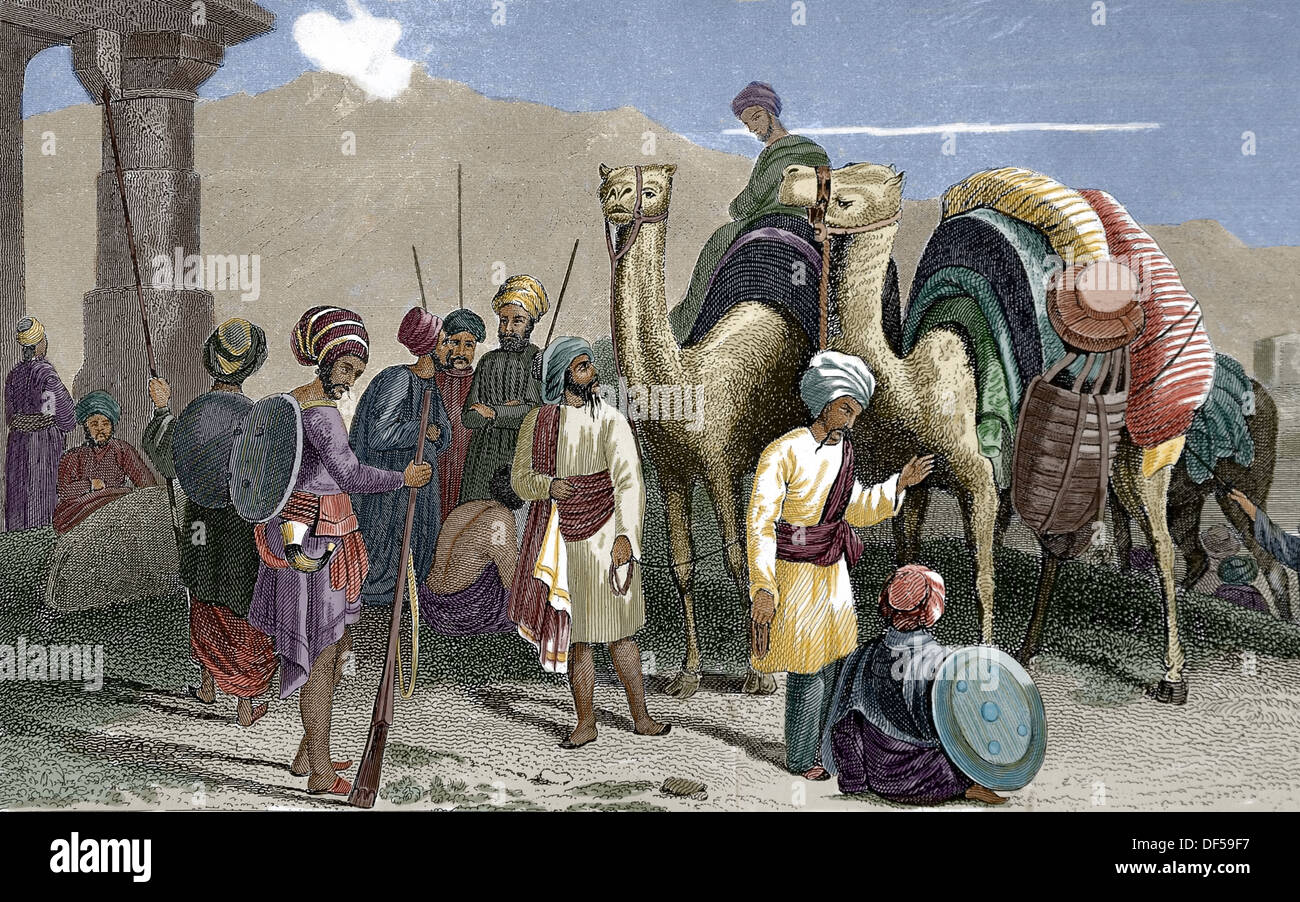 Une caravane arabe avec des chameaux dans le désert Banque de ...