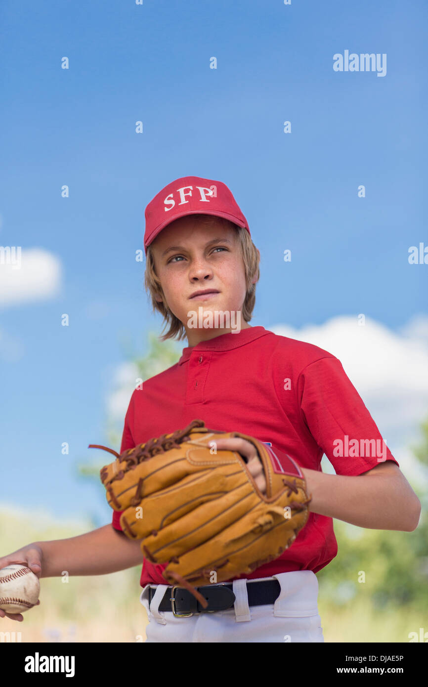 Young boy playing baseball outdoors Photo Stock - Alamy