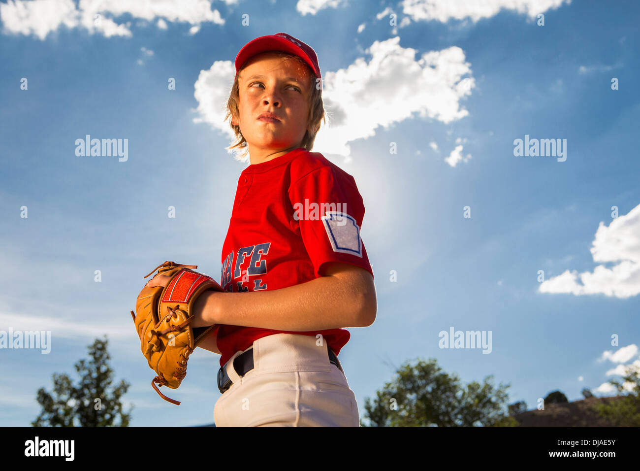 Young boy playing baseball outdoors Photo Stock - Alamy