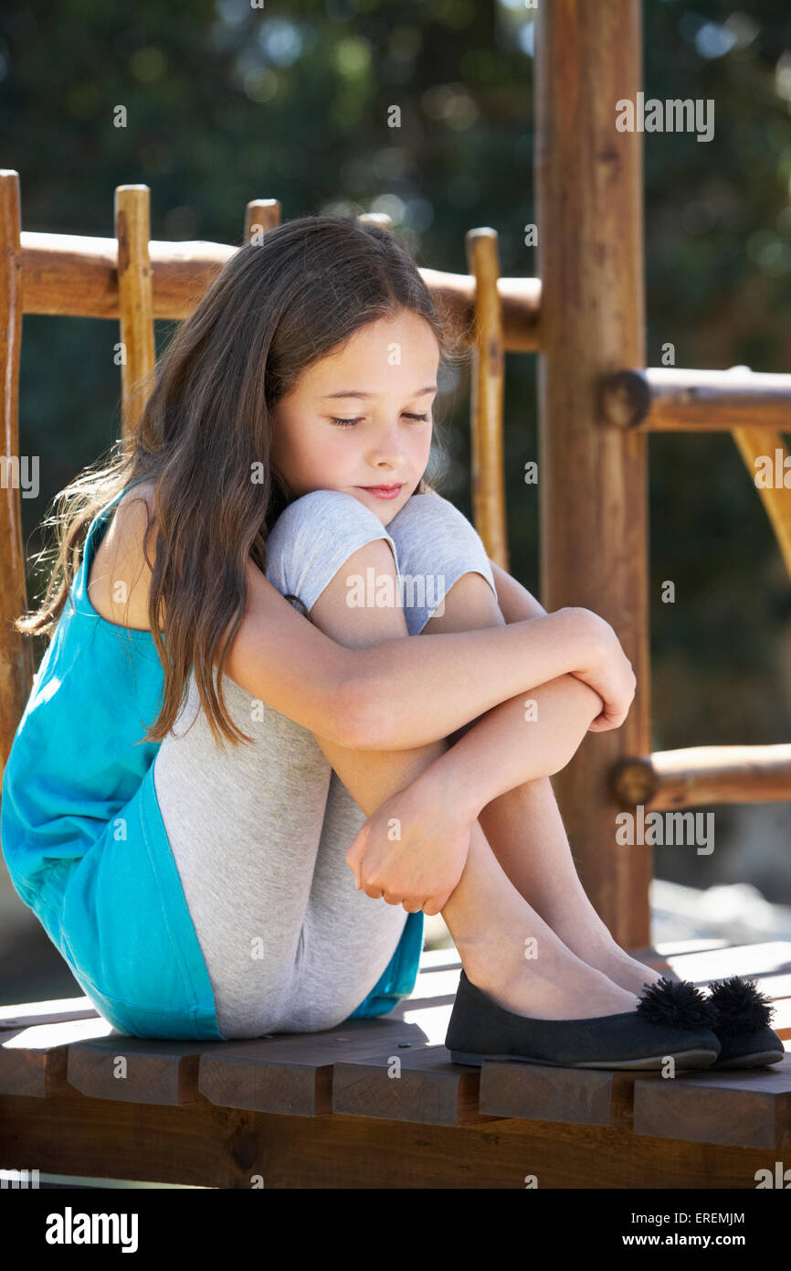 Sad Young Girl Sitting on Escalade Photo Stock - Alamy