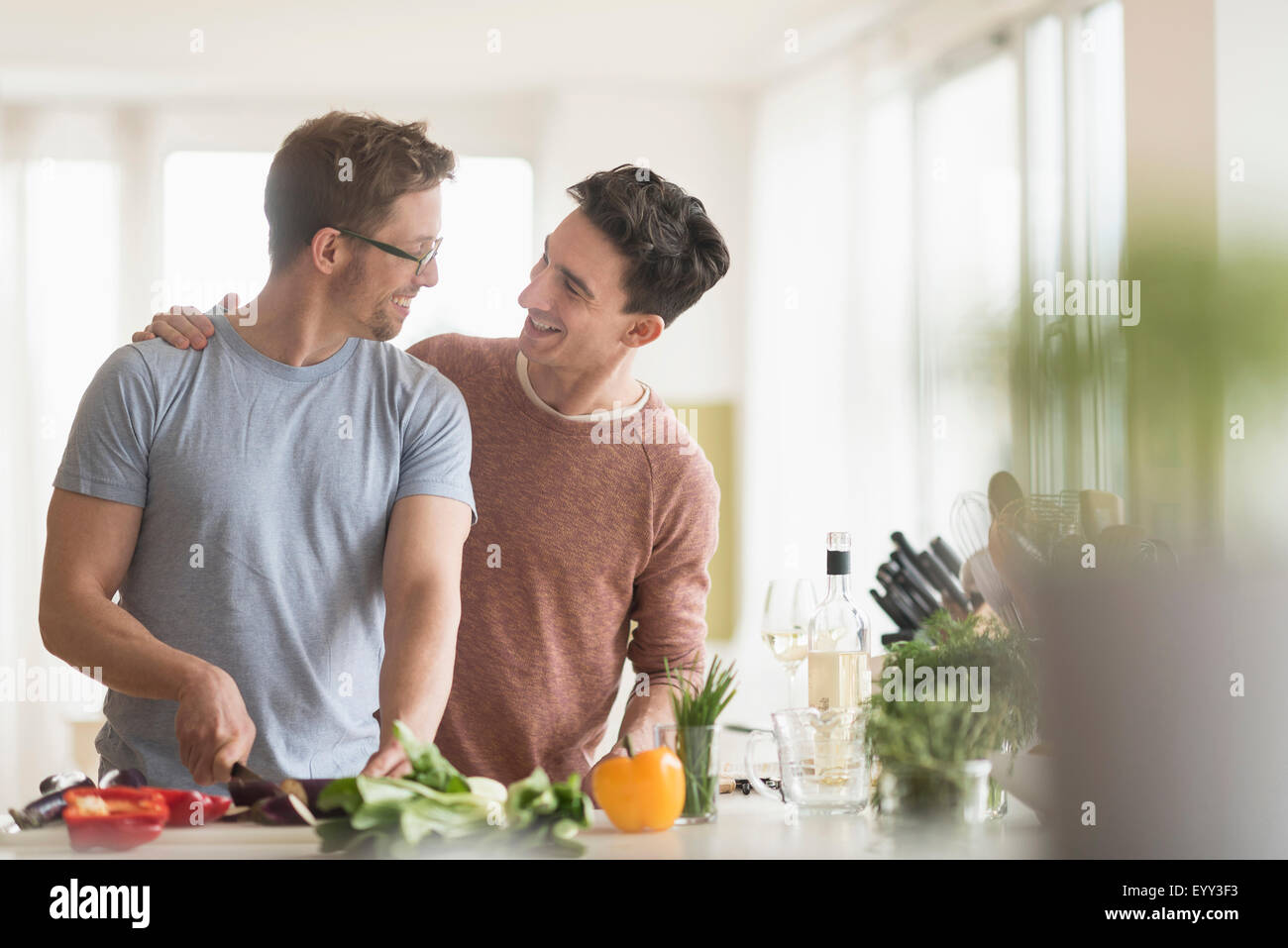 Caucasian gay couple cooking in Banque de photographies et d’images à ...