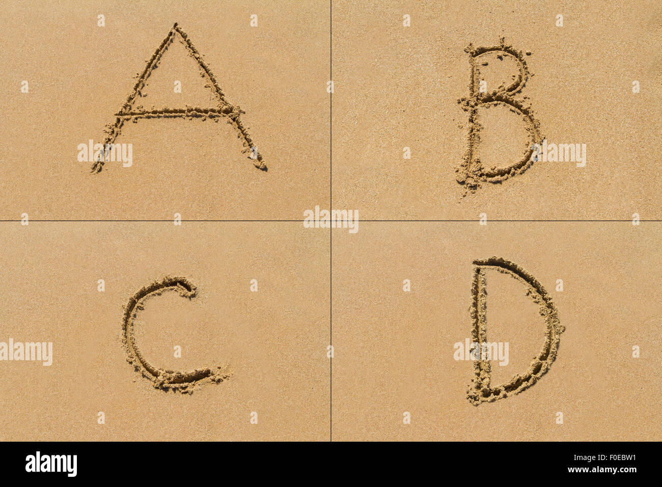 Ensemble de conceptuel A B C D Lettre de l'alphabet écrit sur le sable ...