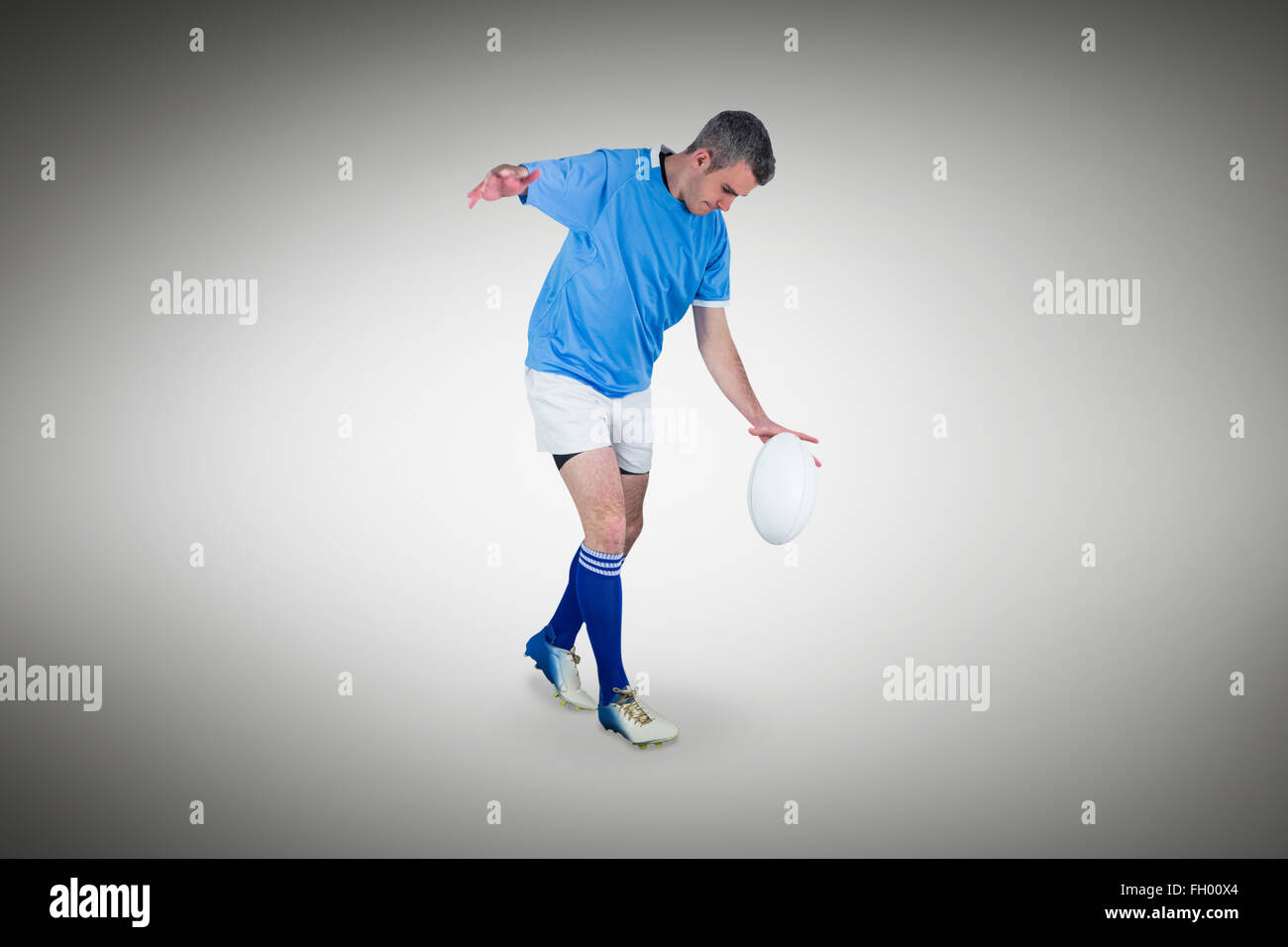Joueur qui frappe un ballon de rugby Banque de photographies et d ...