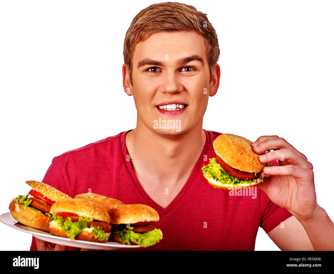 Teen biting into burger Banque de photographies et d’images à haute ...