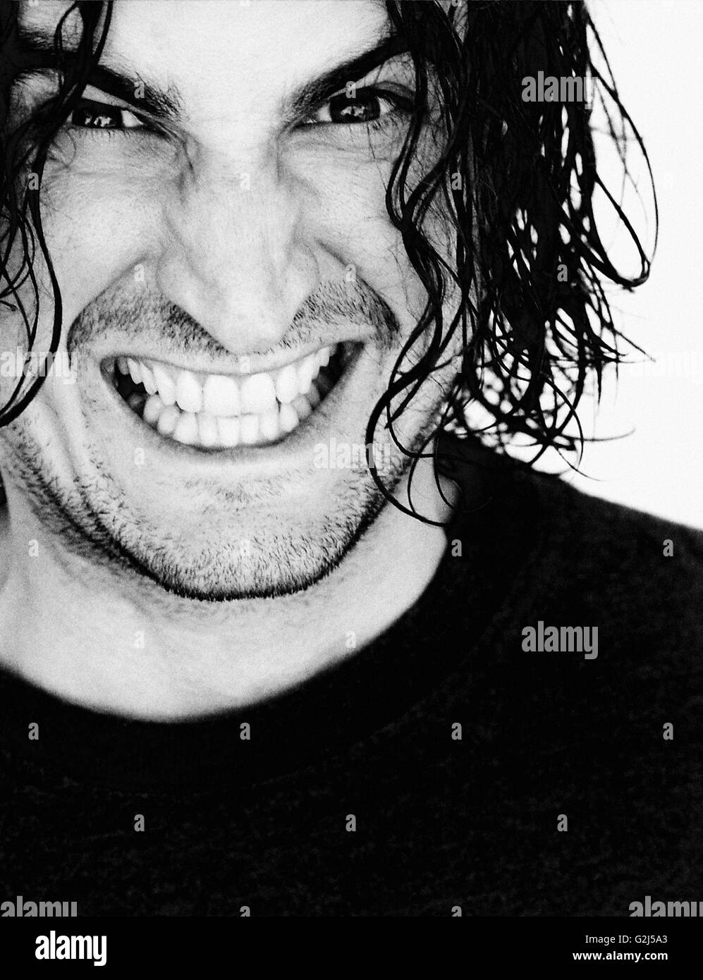 Sourire espiègle Banque d'images noir et blanc - Alamy