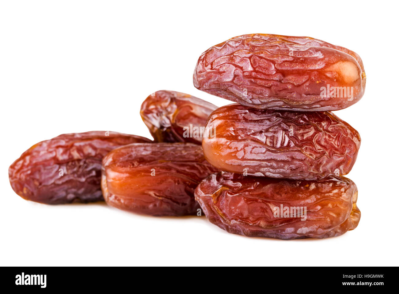 Dattes séchées sucrées pile pile on white Photo Stock - Alamy