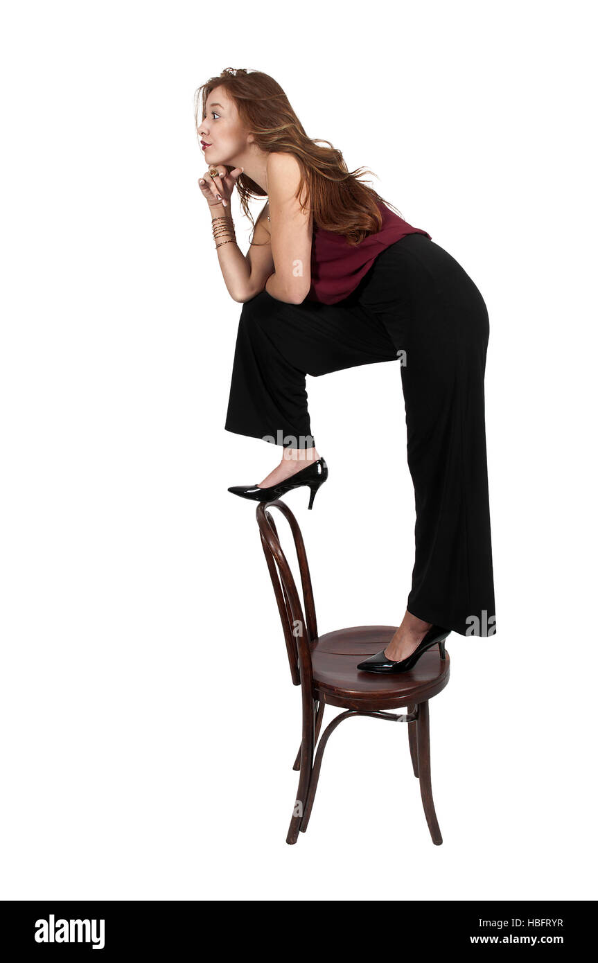 Debout sur une chaise Banque de photographies et d’images à haute résolution - Alamy