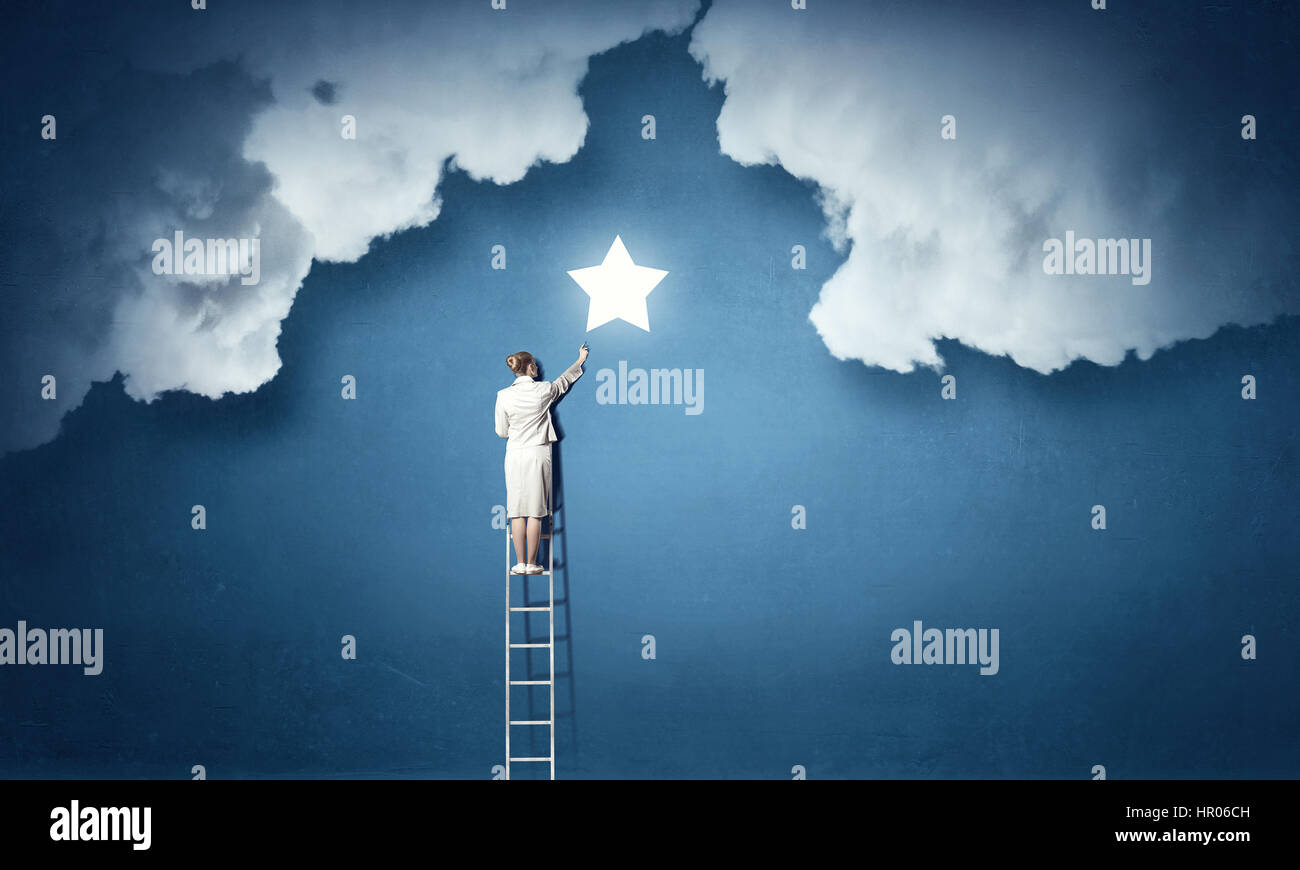 Woman climbing ladder Banque de photographies et d’images à haute ...