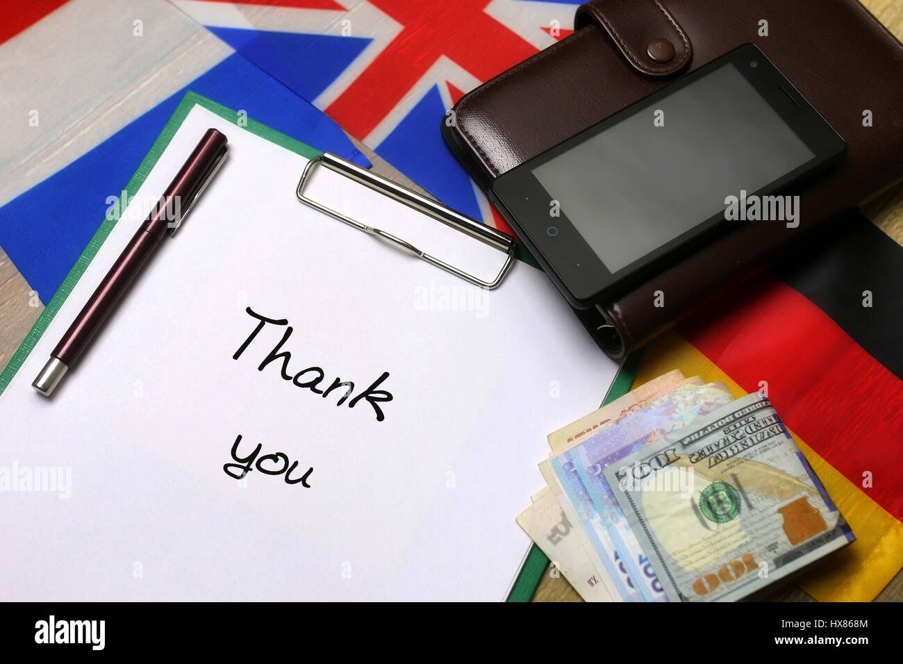 Merci de rédiger du texte sur papier à texture bois bureau avec mob ...