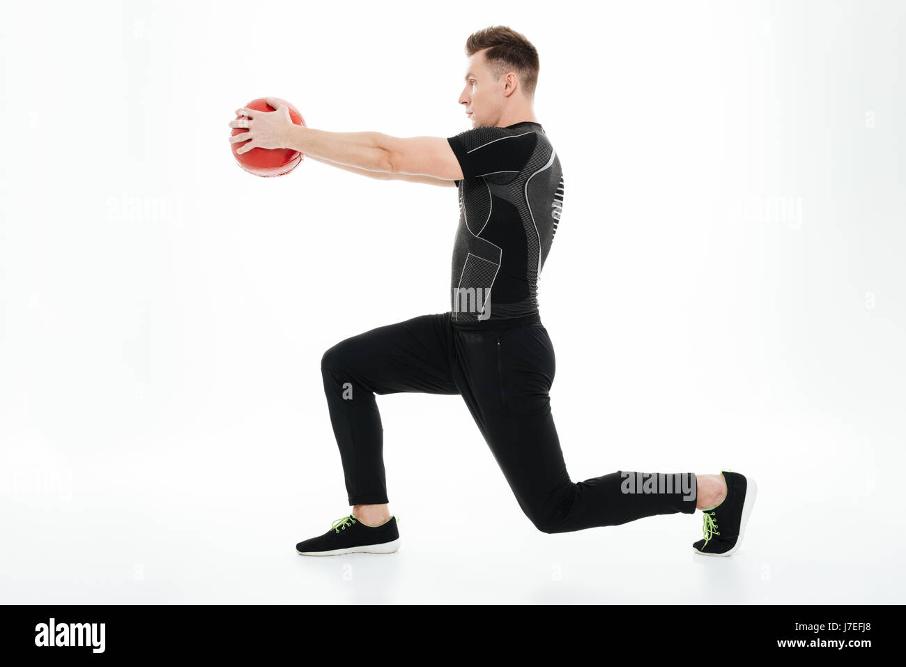 Side view full length portrait d'un jeune sportif en bonne santé ...