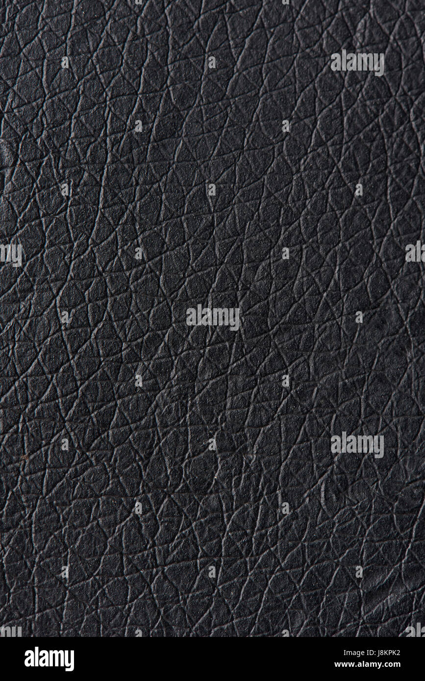 Schéma de surface en cuir noir. La texture de la peau noire de macro ...