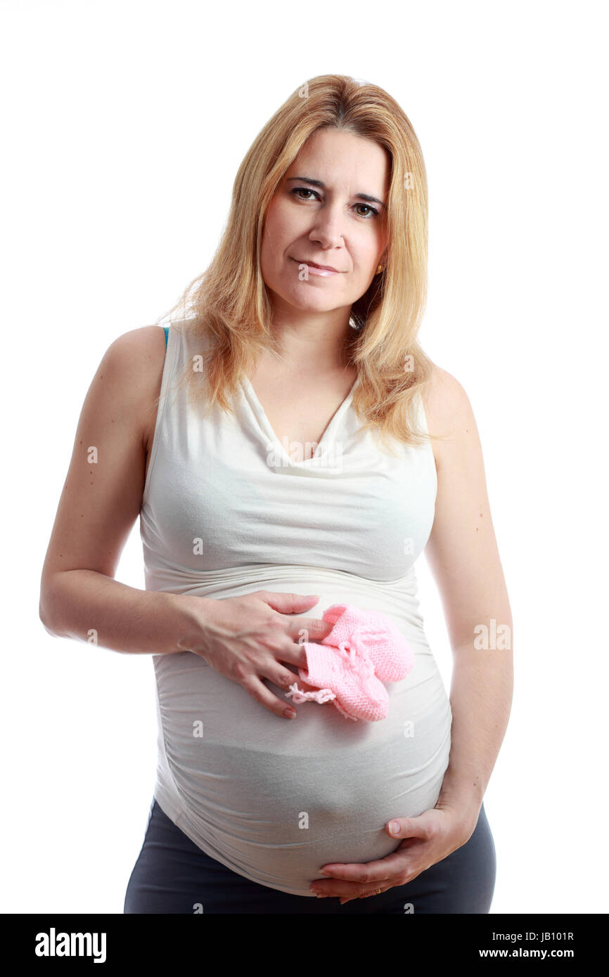 Détails Dune Femme Enceinte Avec Les Chaussons Bébé Sur Son Ventre Et