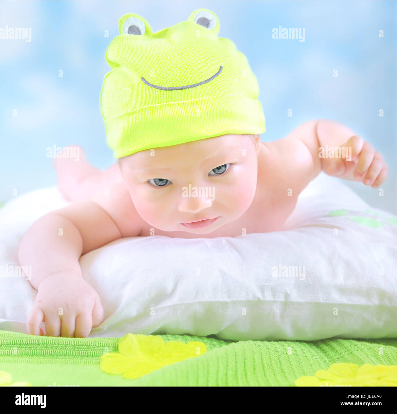 Closeup portrait of cute little baby wearing costume grenouille drôle ...