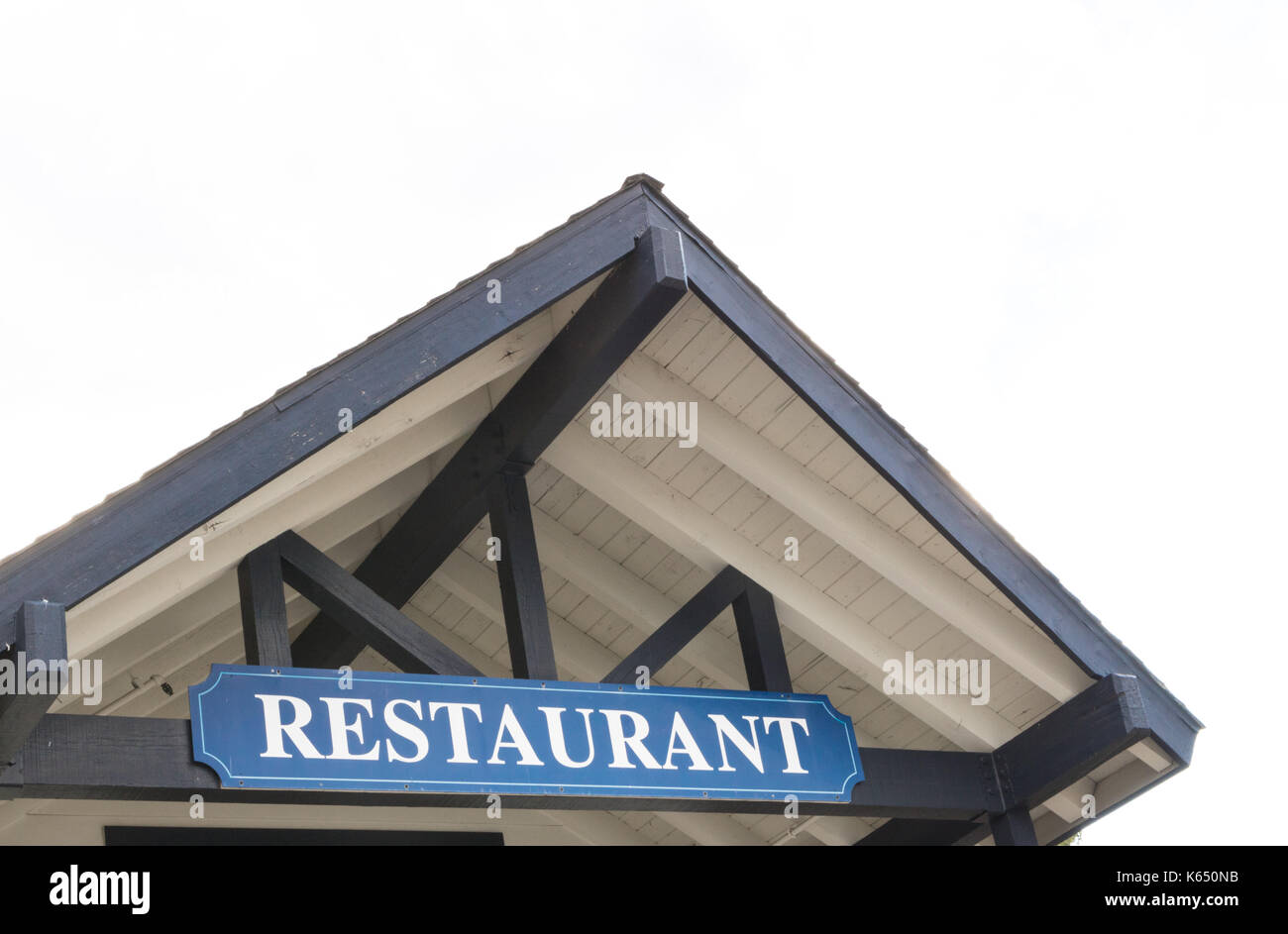 Generic restaurant sign, blue background white majuscules sur bâtiment ...
