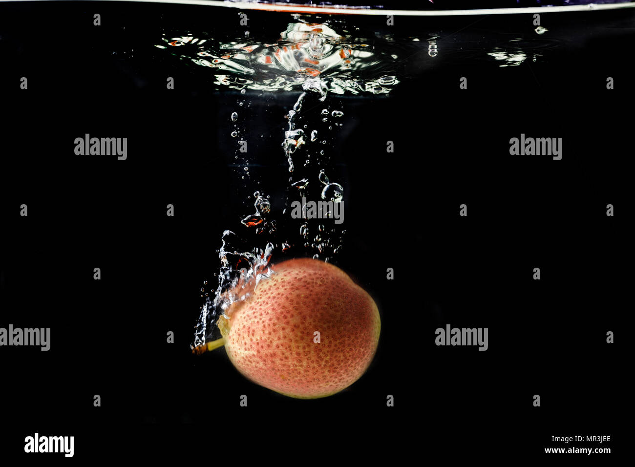 Fruit juice splash poire Banque de photographies et d’images à haute ...