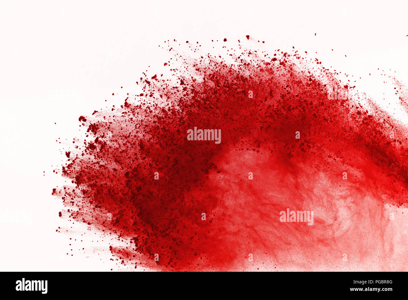 Résumé rouge en poudre d'explosion au fond blanc. abstract red dust ...