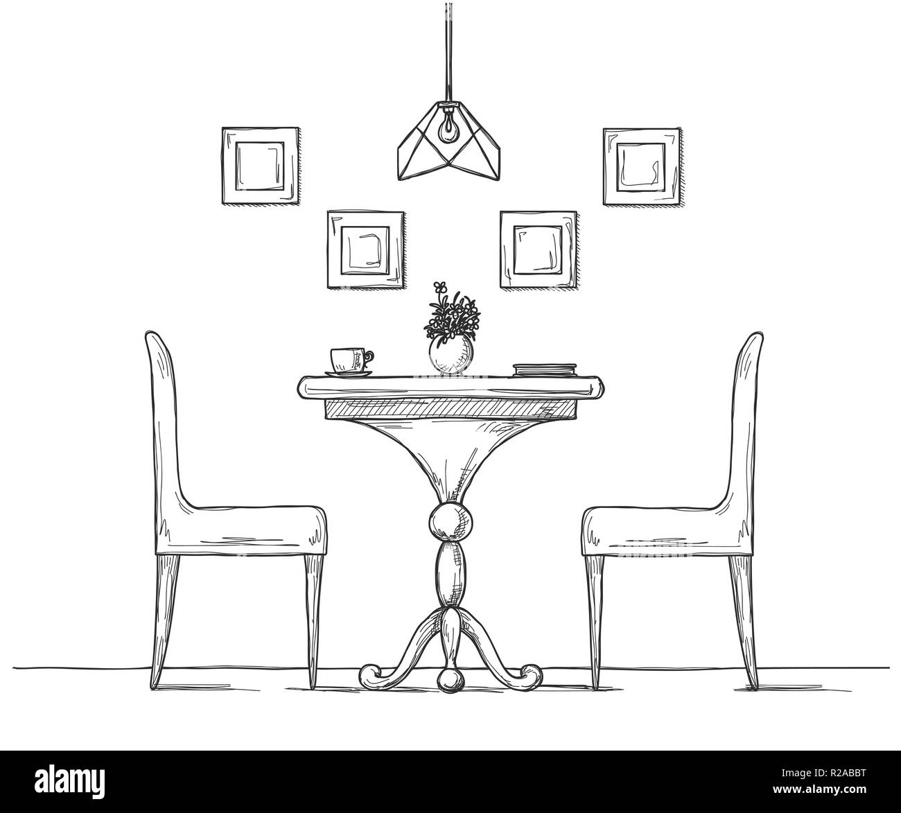Une partie de la salle à manger. Table ronde et chaises.Sur la table ...