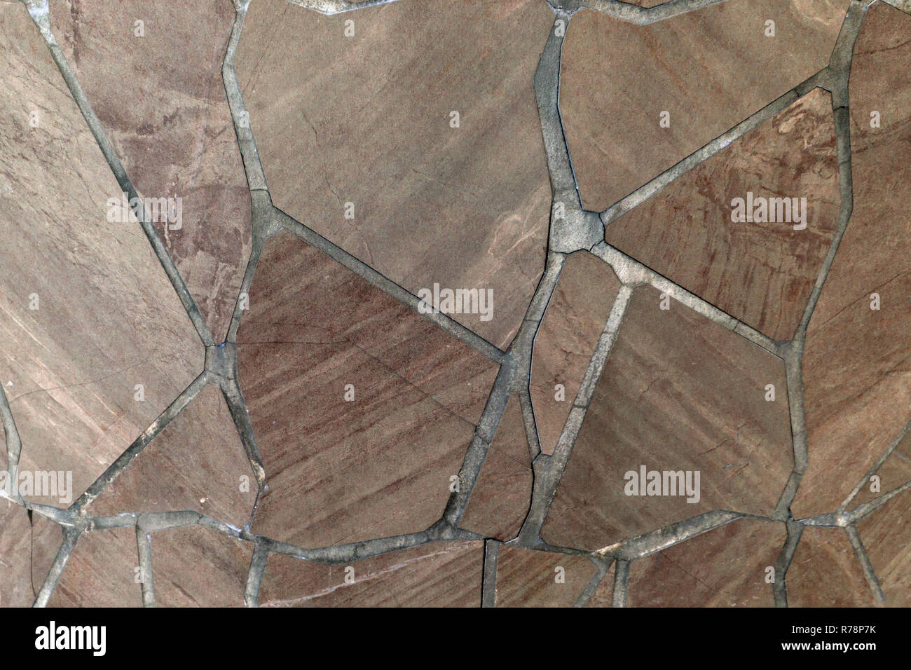 La pierre naturelle de couleur marron, un morceau d'un mur d'une pierre ...