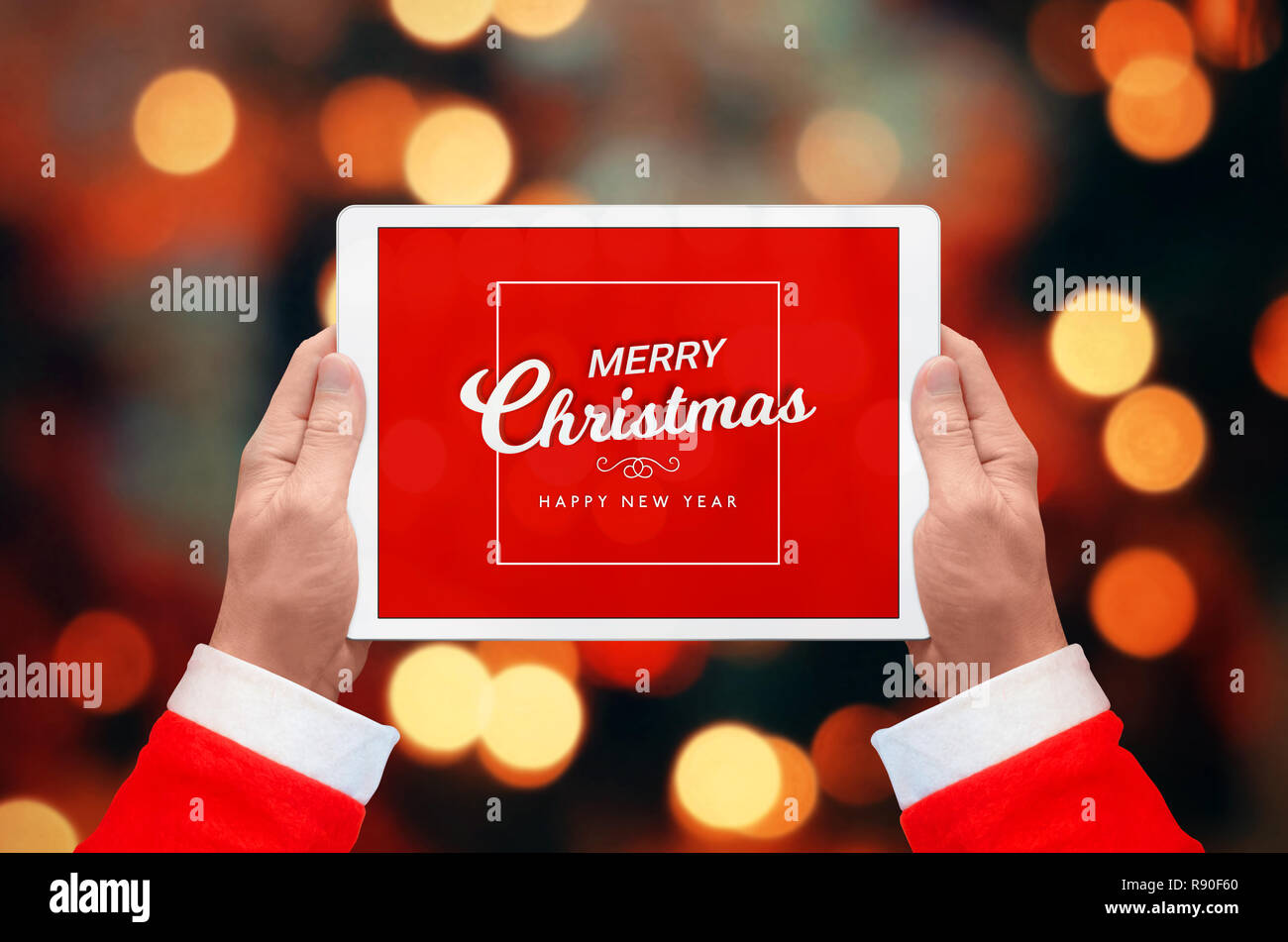 Père Noël tenir tablet en position horizontale avec Joyeux Noël et ...