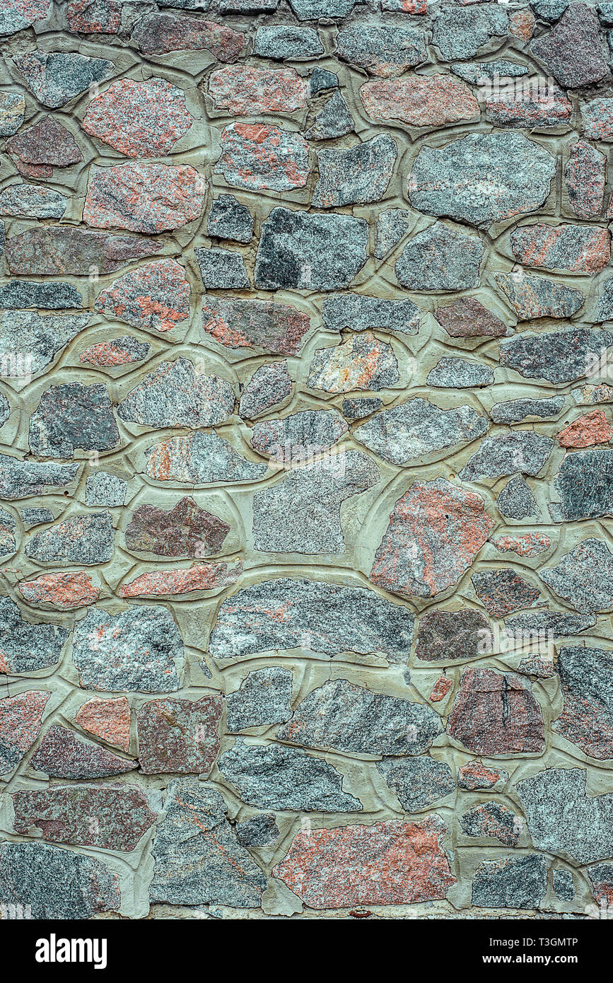 Mur de moellons de gris et couleur rouge. La texture de surface murale ...