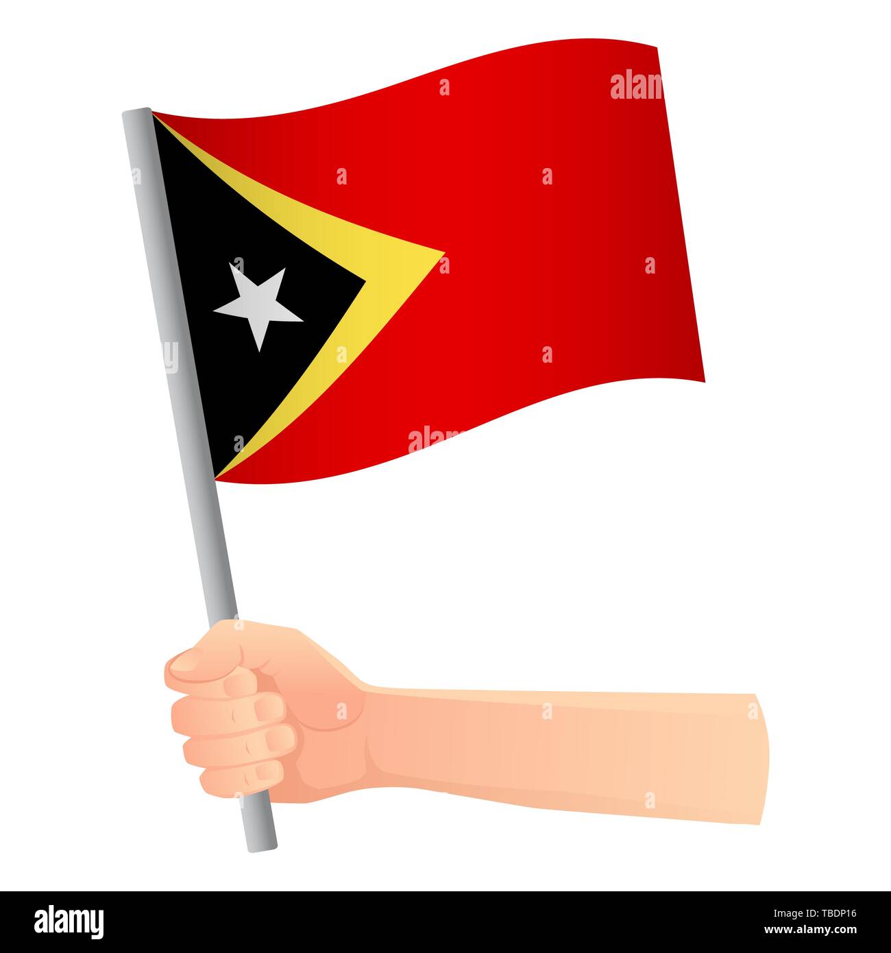 Le Timor-oriental drapeau dans la main. Contexte patriotique. Drapeau ...