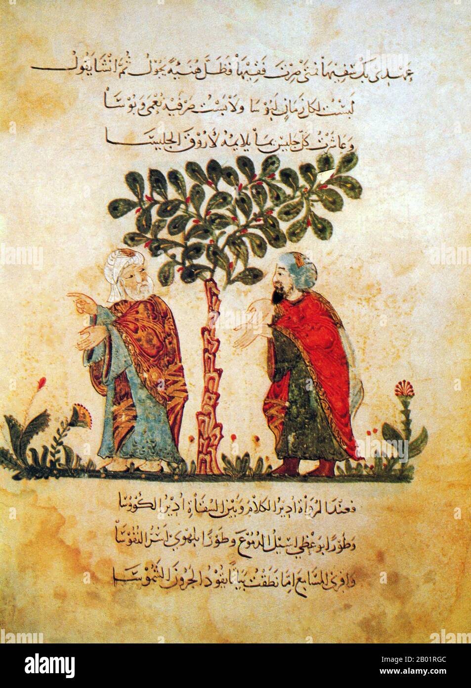 Iraq: Due uomini in conversazione sotto un albero, uno che indica la ...