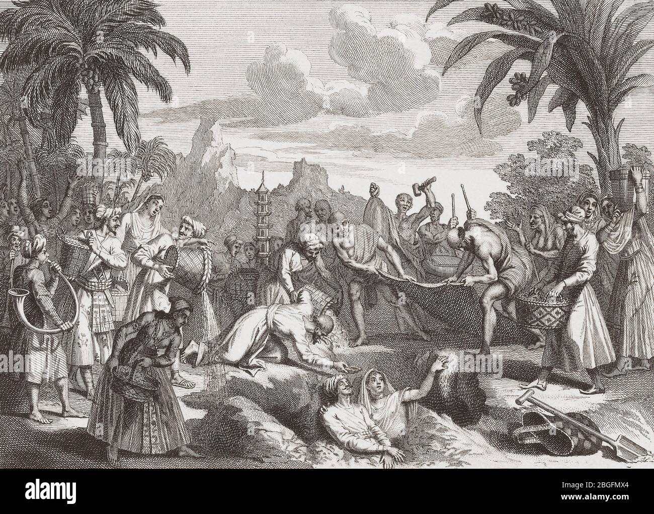 In India, una donna indù si depone accanto al marito morto in una tomba ...