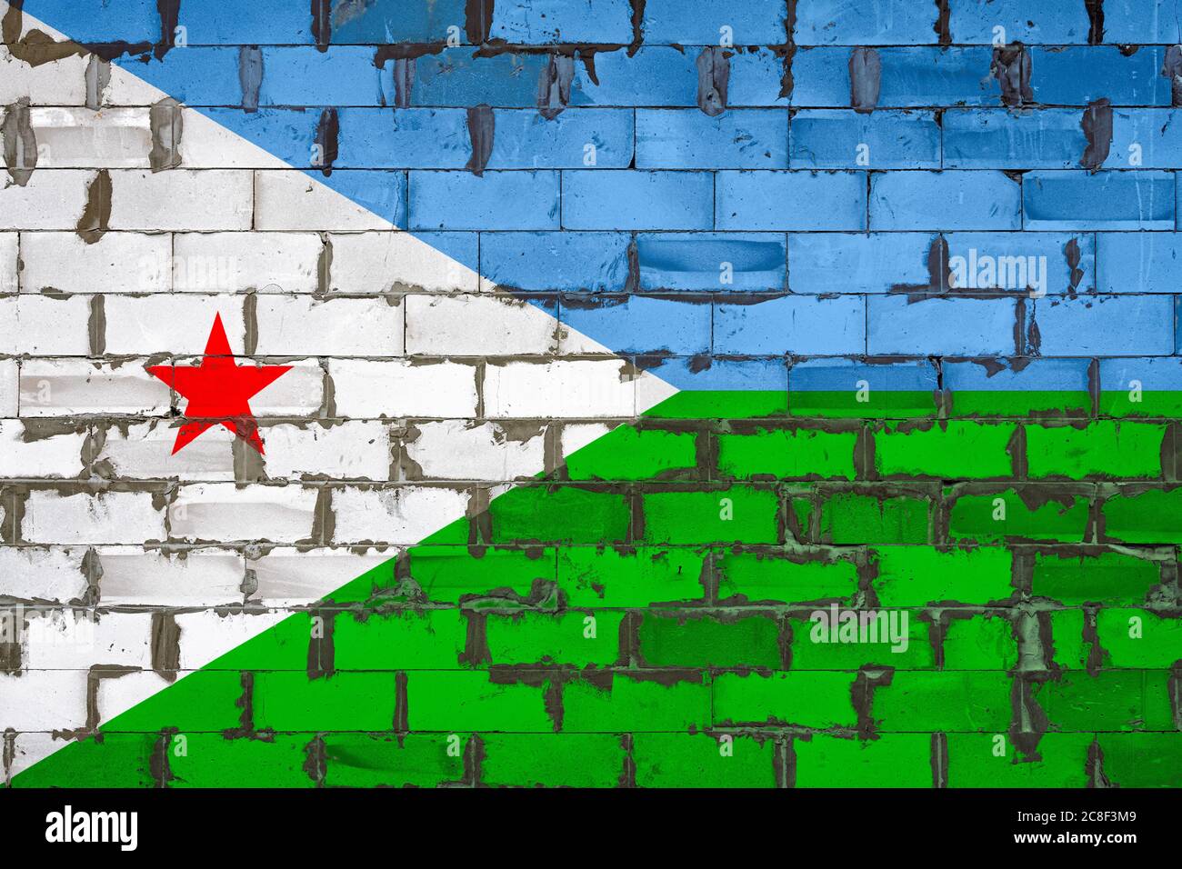 La bandiera nazionale di Gibuti dipinse su un muro di blocchi di sigbit ...