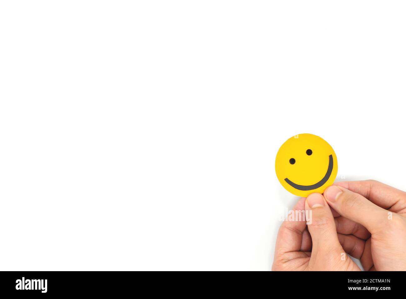 Hand holding smiley face emoticon immagini e fotografie stock ad alta ...