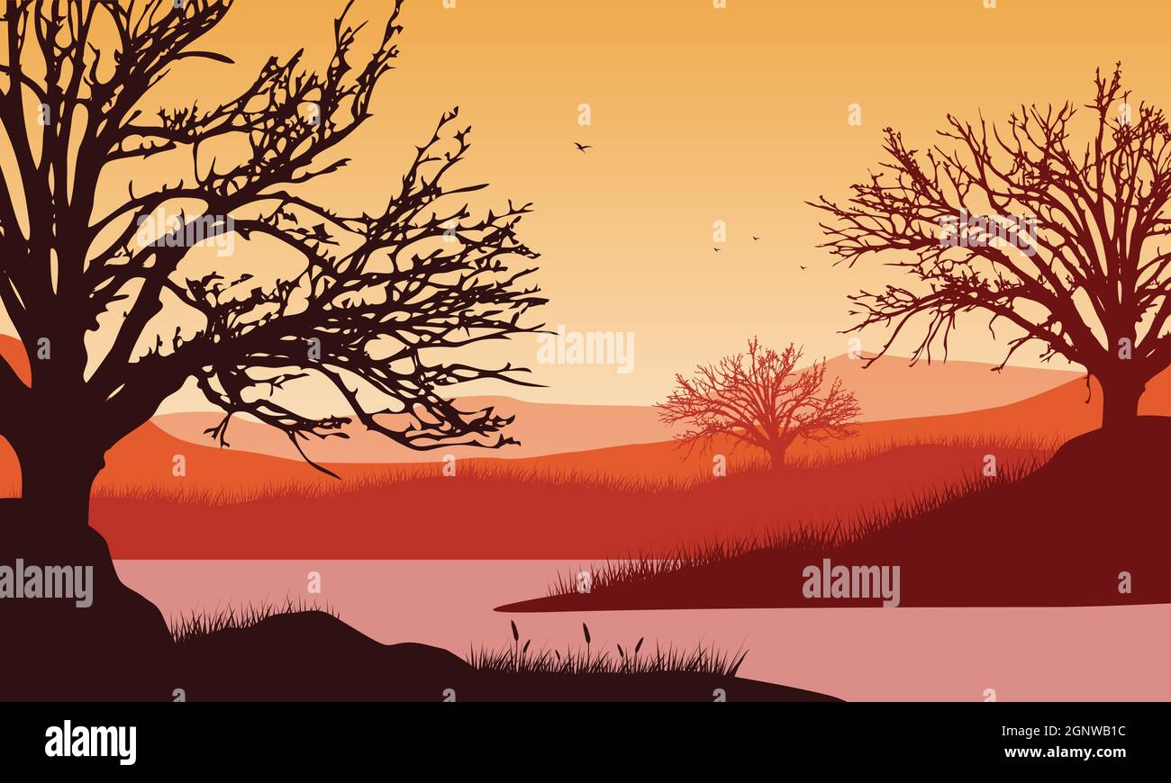 Splendida vista sulle montagne con sagome di alberi secchi al tramonto ...