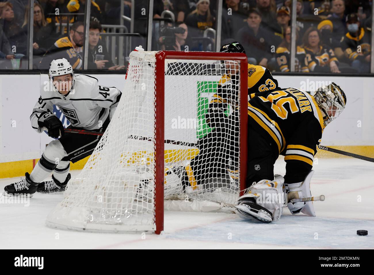 Boston Bruins goaltender Linus Ullmark watches the puck go through the ...
