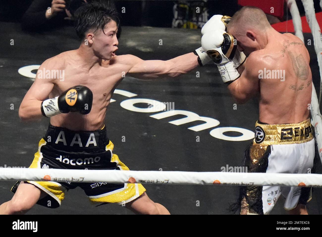 Naoya Inoue of Japan, left, throws a punch at Paul Butler of Britain ...