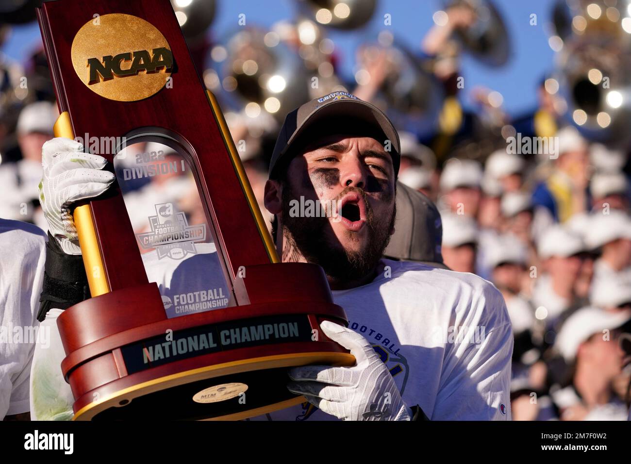 South Dakota State offensive lineman Mason McCormick holds up the ...