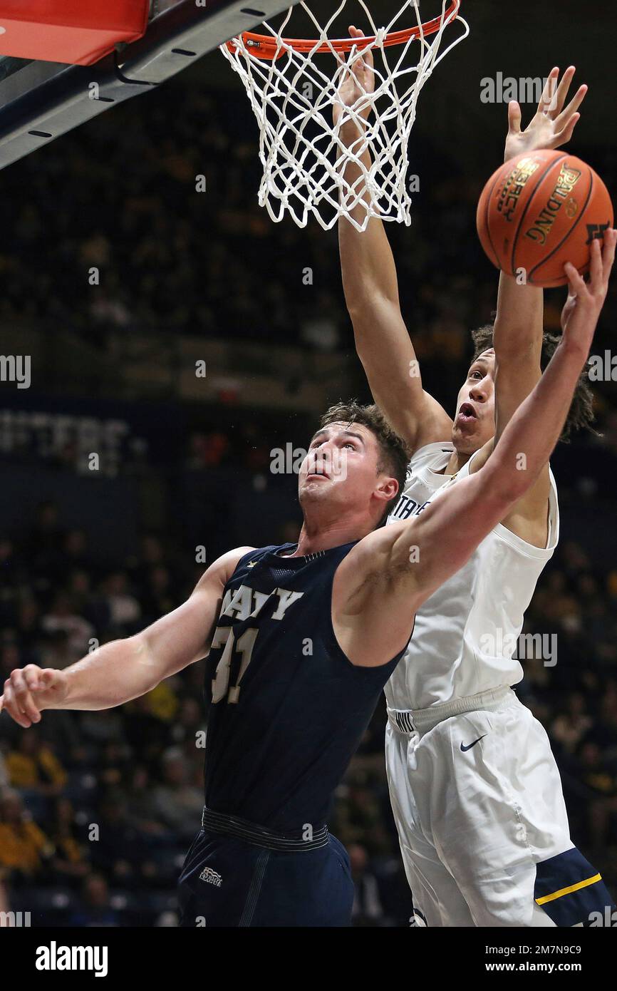 Navy forward Daniel Deaver (31) is defended by West Virginia forward ...
