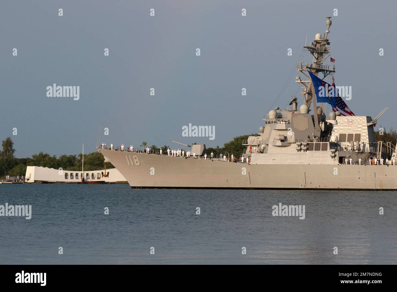 Sailors aboard the the USS Daniel Inouye render honors while passing ...