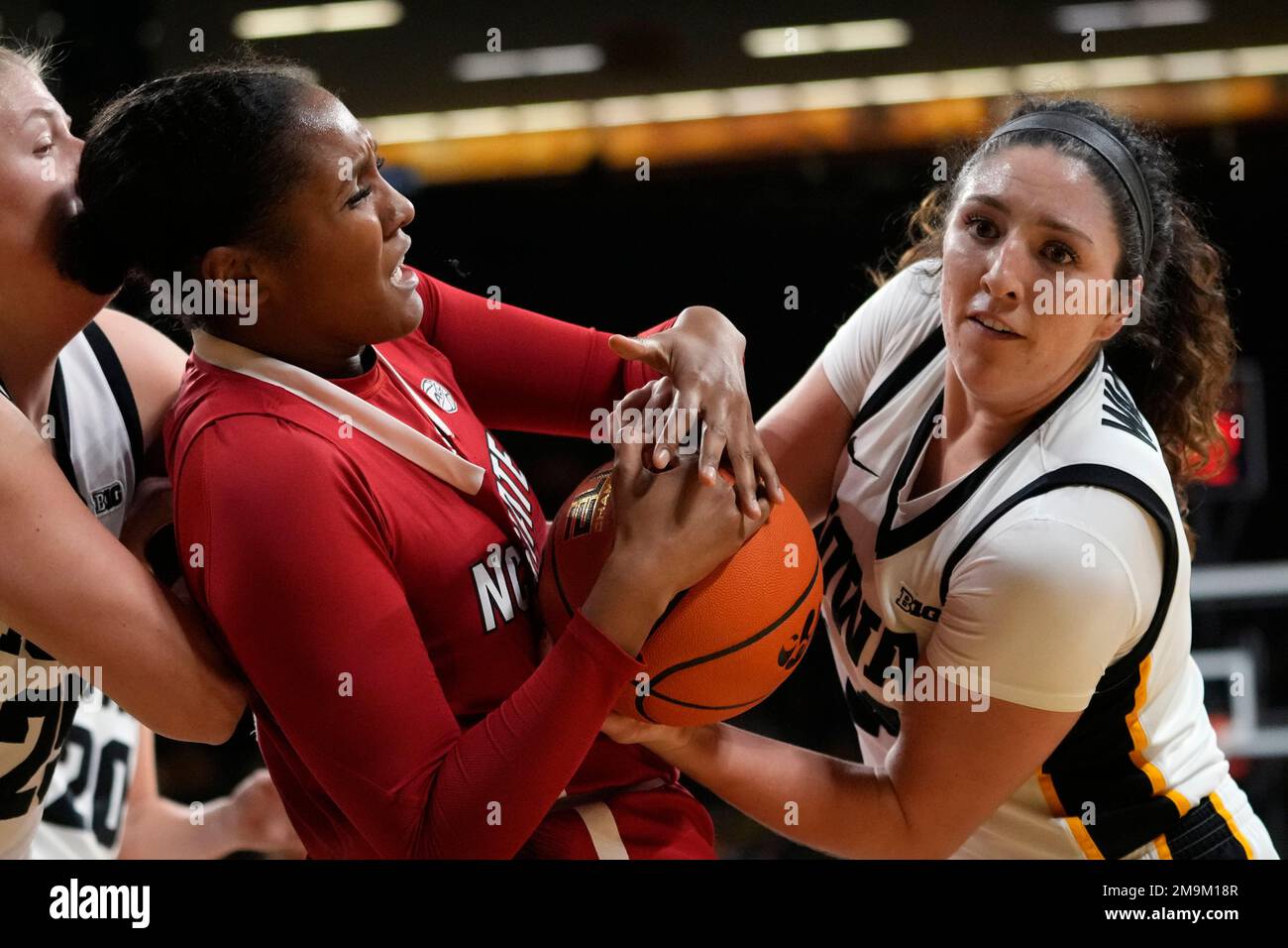 North Carolina State center Camille Hobby fights for a loose ball with ...