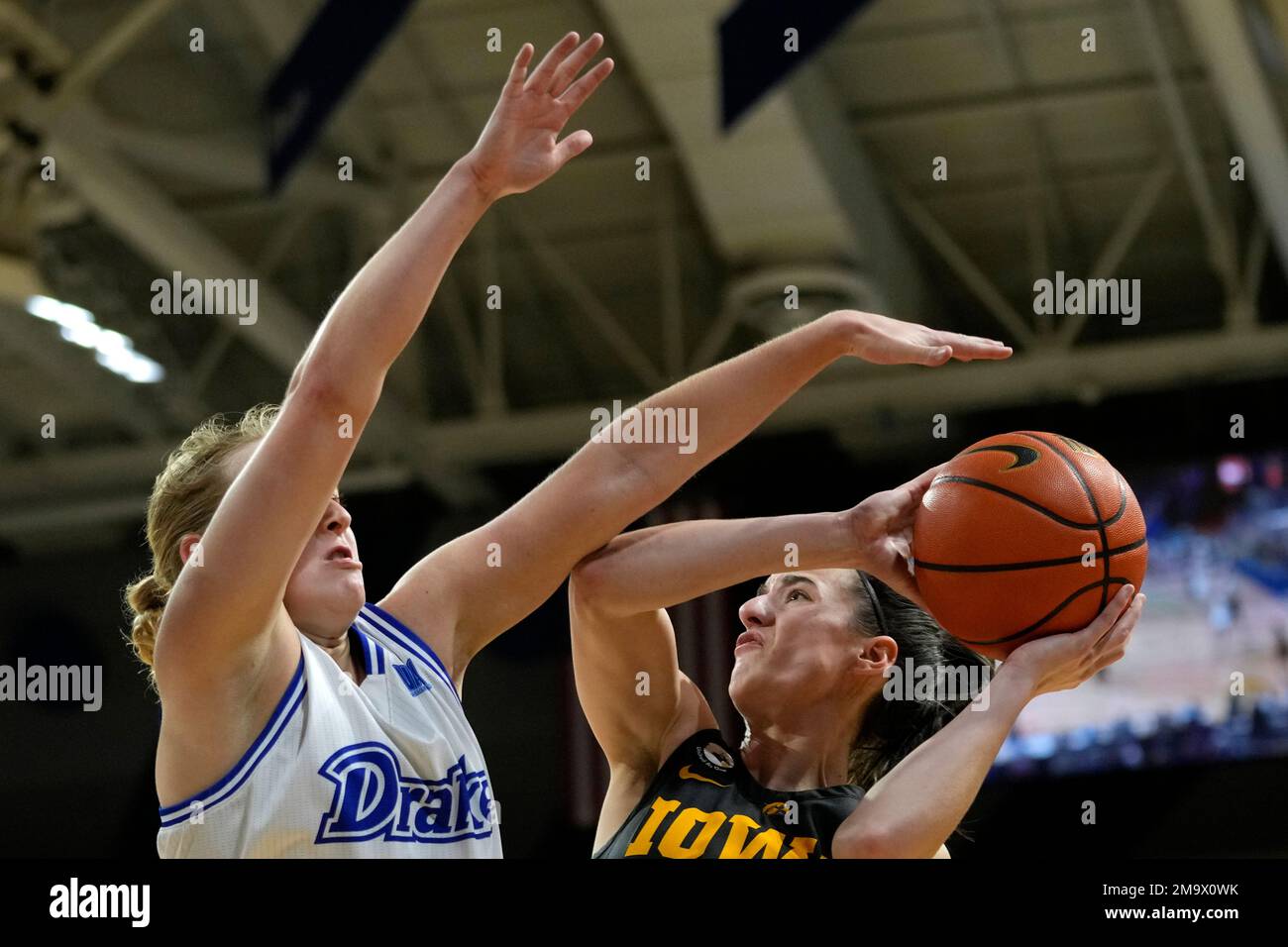 Iowa guard Caitlin Clark, right, shoots over Drake guard Sarah Beth ...
