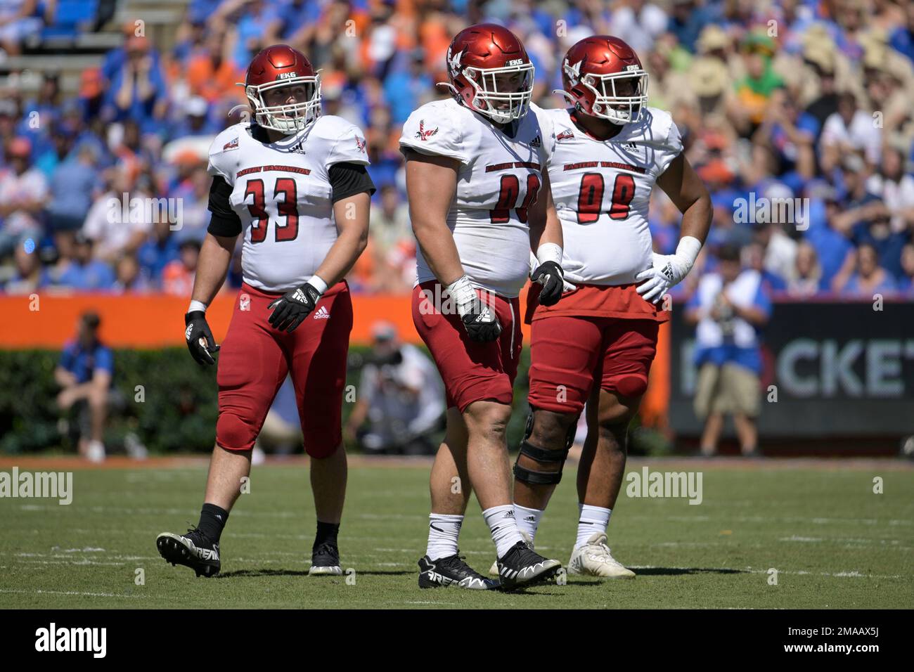 Eastern Washington linebacker Derek Tommasini (33), defensive lineman ...