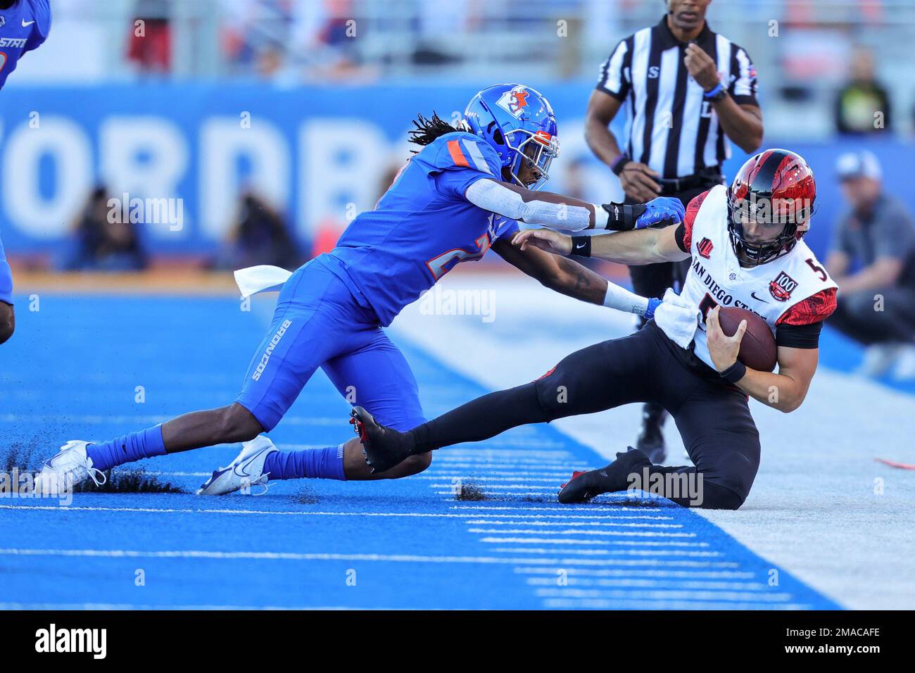 San Diego State quarterback Braxton Burmeister (5) is pushed out of ...
