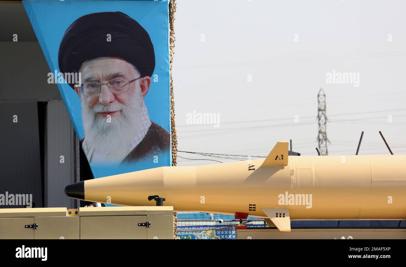 A" Khaibar-buster" missile is carried past a portrait of Iranian ...