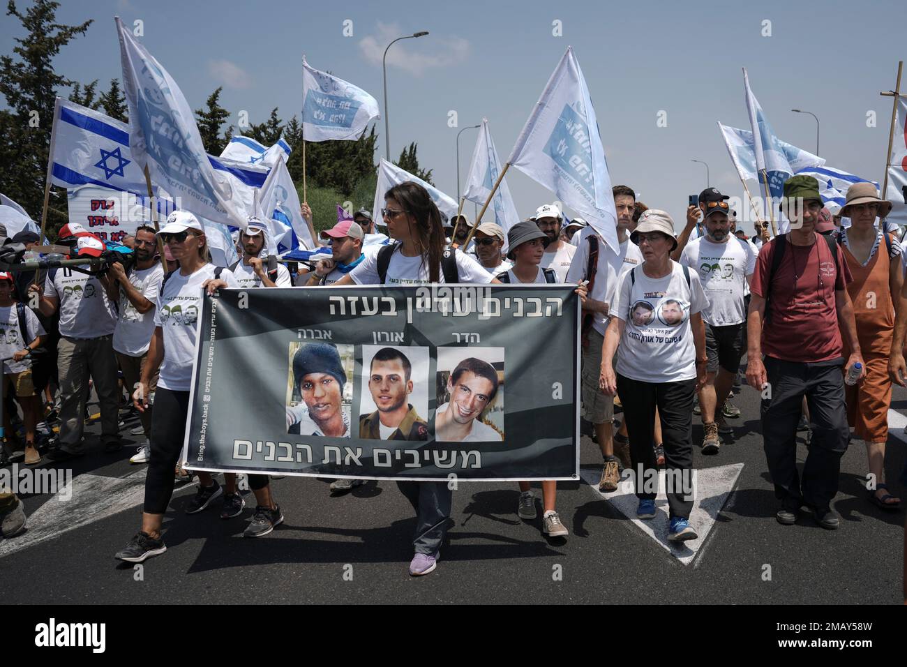 Supporters and family members of Israeli soldiers Hadar Goldin and Oron ...