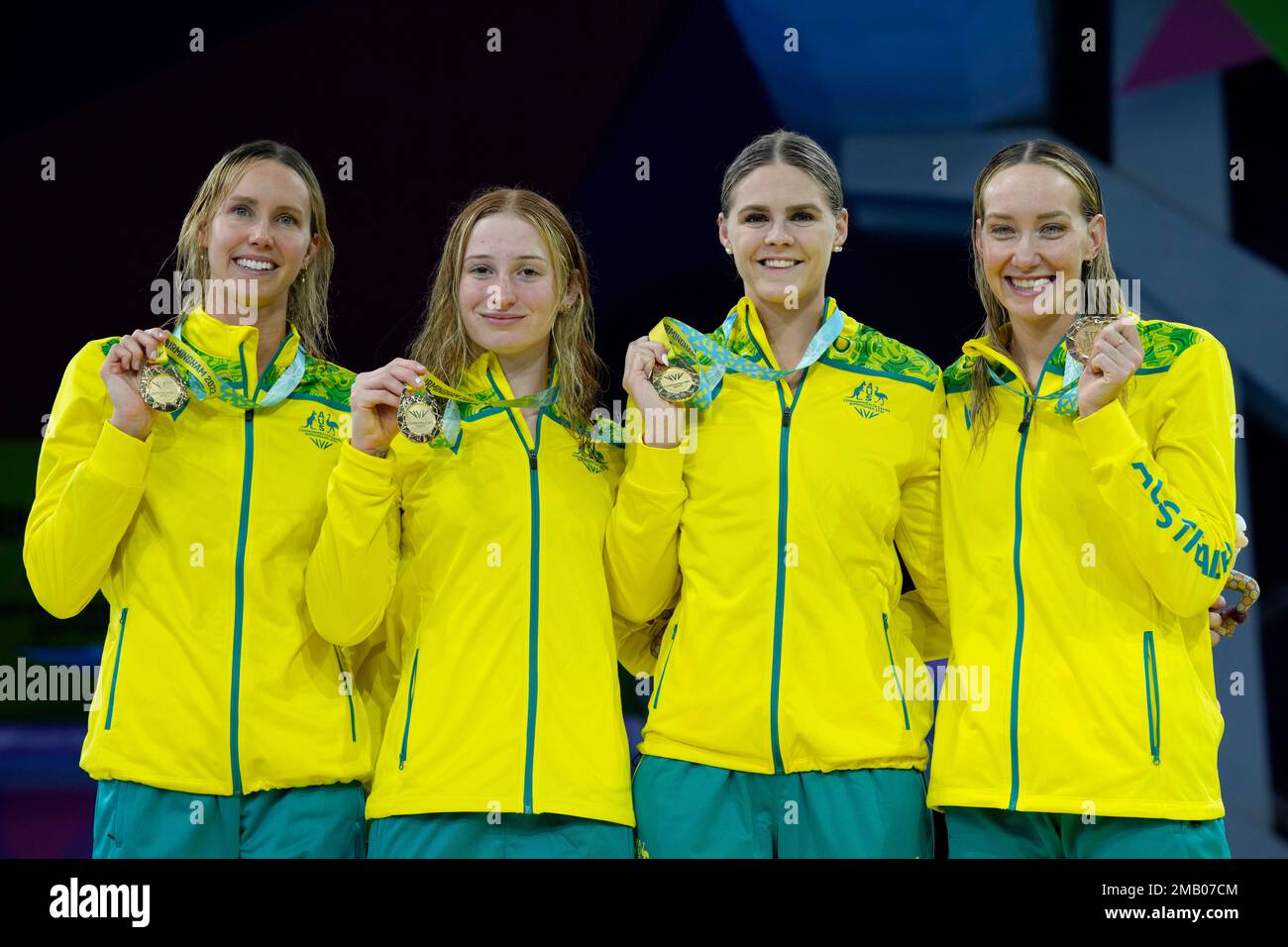 Swimmers of team Australia pose after winning the gold medal in the Women's 4x100 meters ...