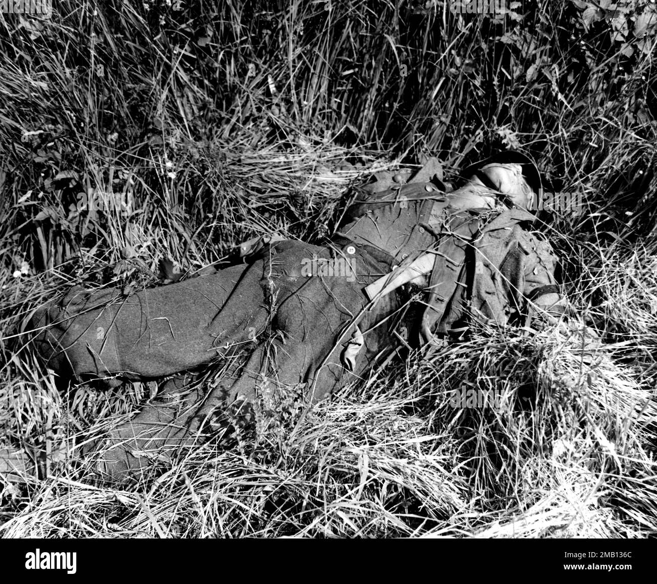 In this handout from the U.S. Navy, a dead German soldier lies sprawled ...