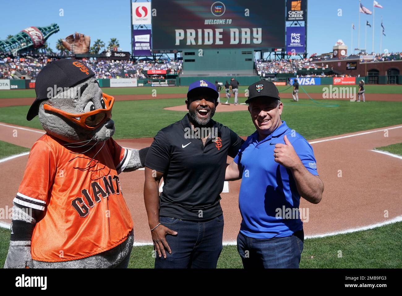 San Francisco Giants mascot Lou Seal, left, watches as Roscoe Mapps ...