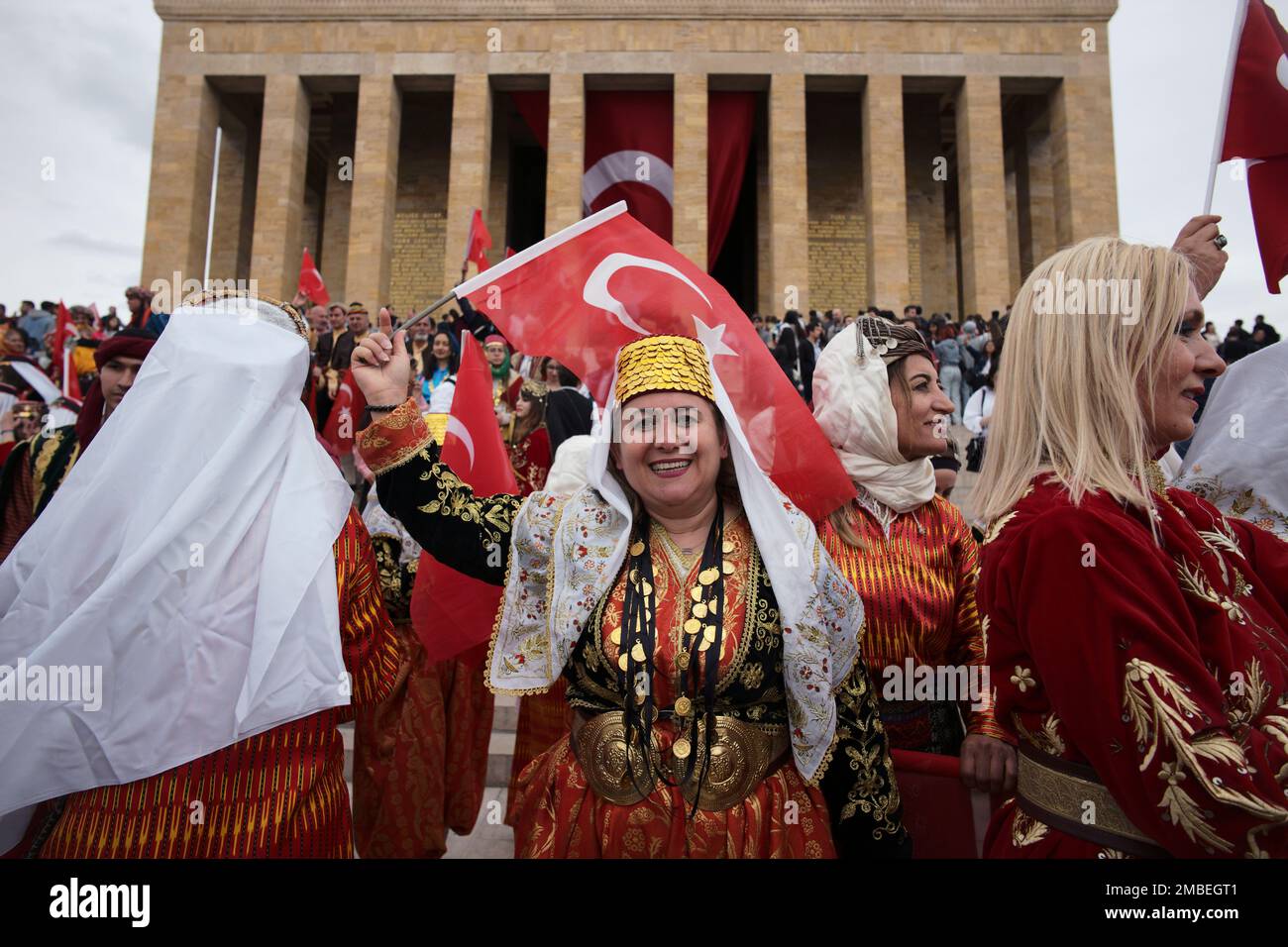 A woman waves a national flag as thousands of people visit the mausoleum of Mustafa Kemal ...