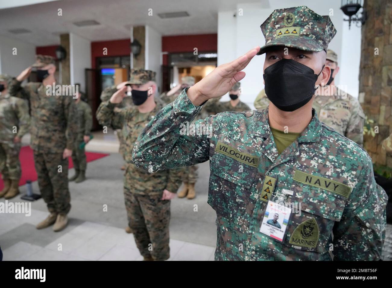 Philippine and U.S. soldiers salute to their flags as the national ...